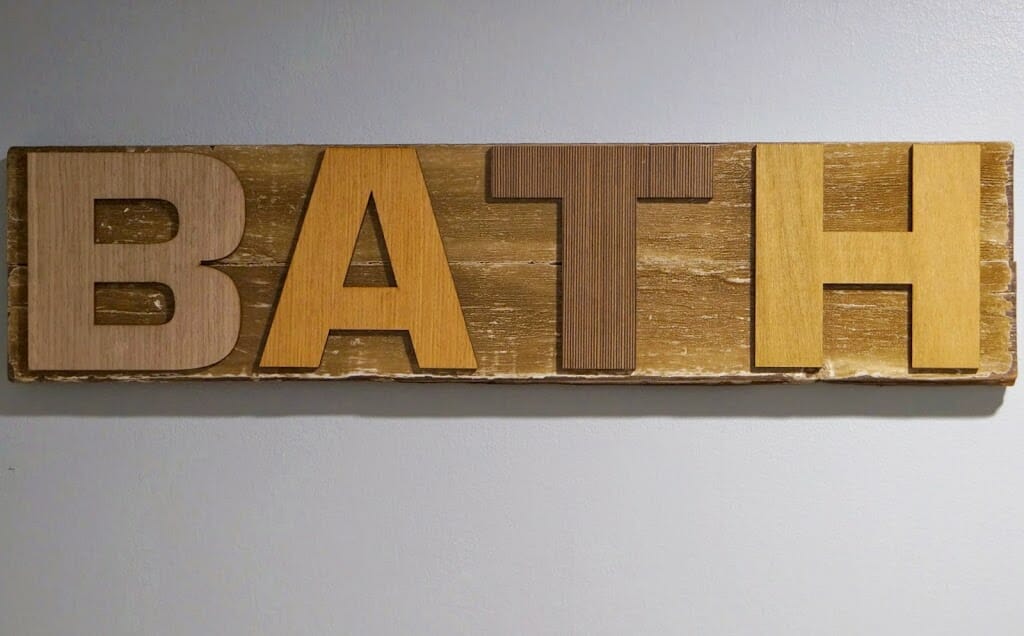 Create a Unique DIY Reclaimed Wood Bath Art and Towel Rack